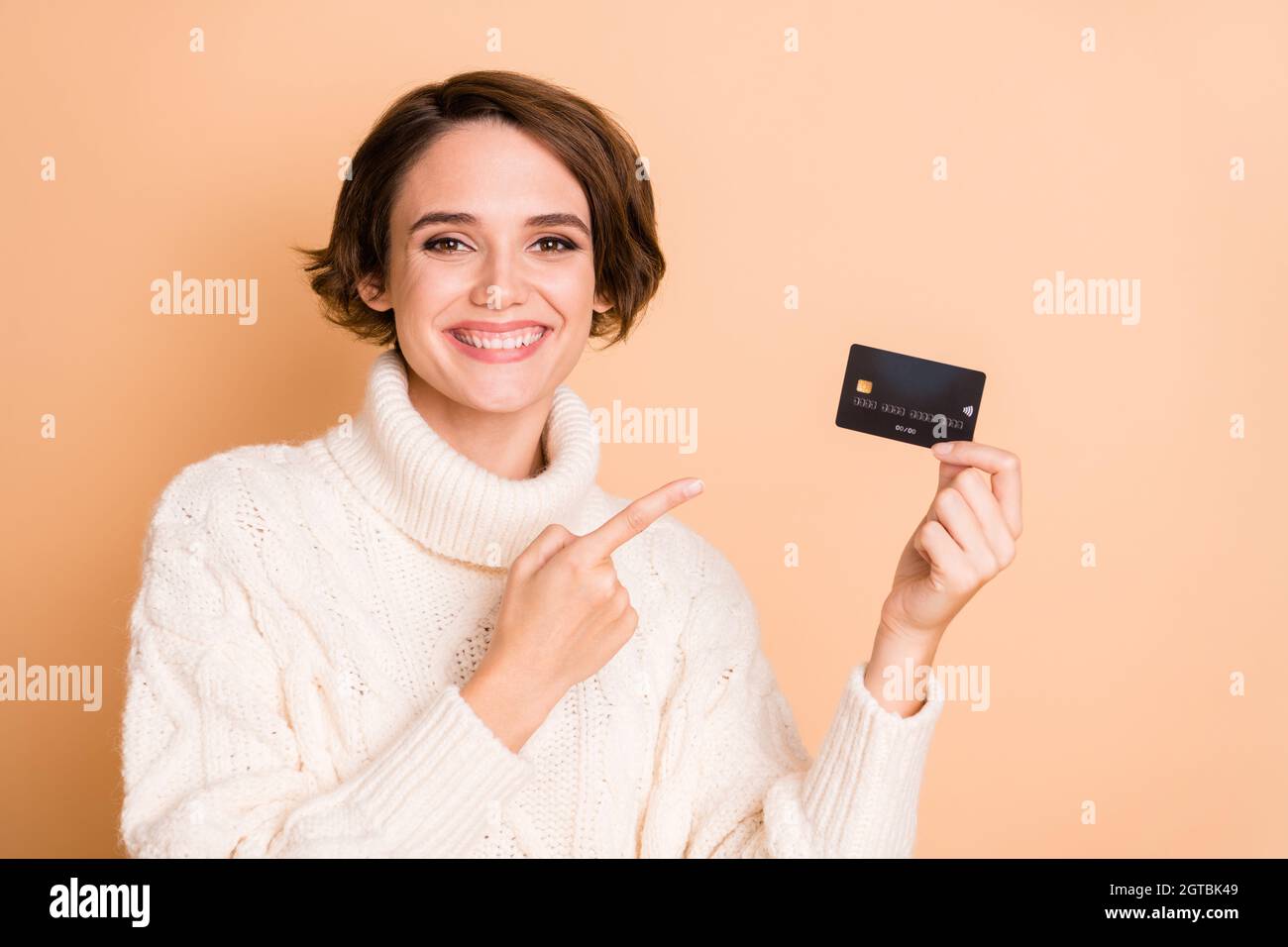 Photo portrait of young girl pointing finger plastic debit card ...
