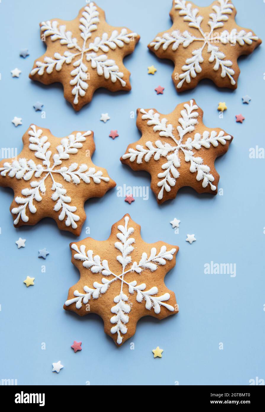 Christmas gingerbread cookies on a blue background. Homemade delicious ...