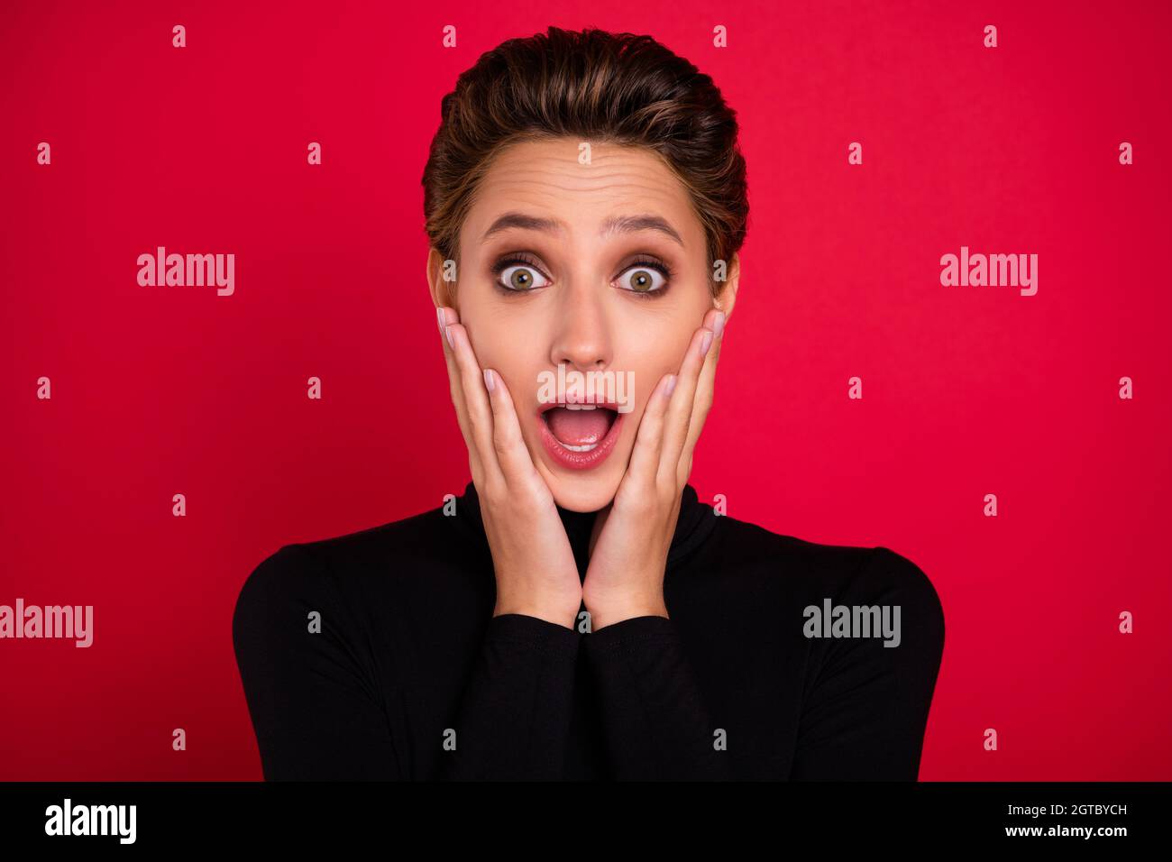 Photo Of Amazed Astonished Woman Hold Hands Face Cheeks Reaction