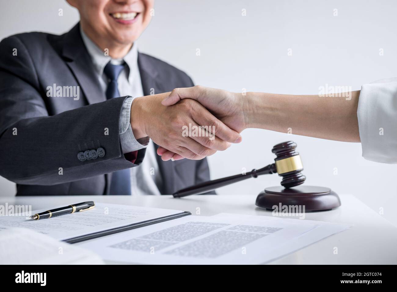 Judge lawyer shaking hands in hi-res stock photography and images - Alamy