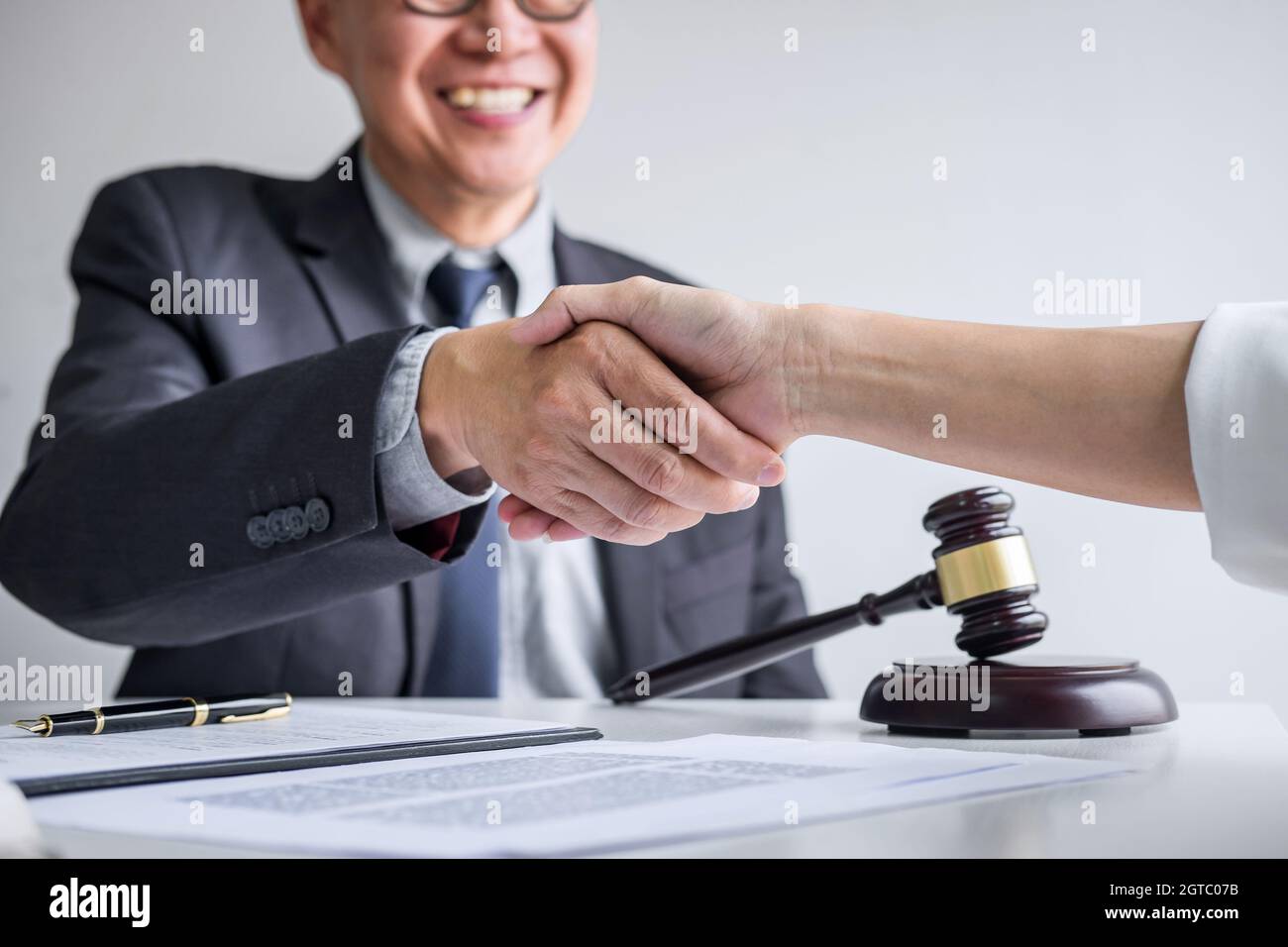 Judge lawyer shaking hands in hi-res stock photography and images - Alamy