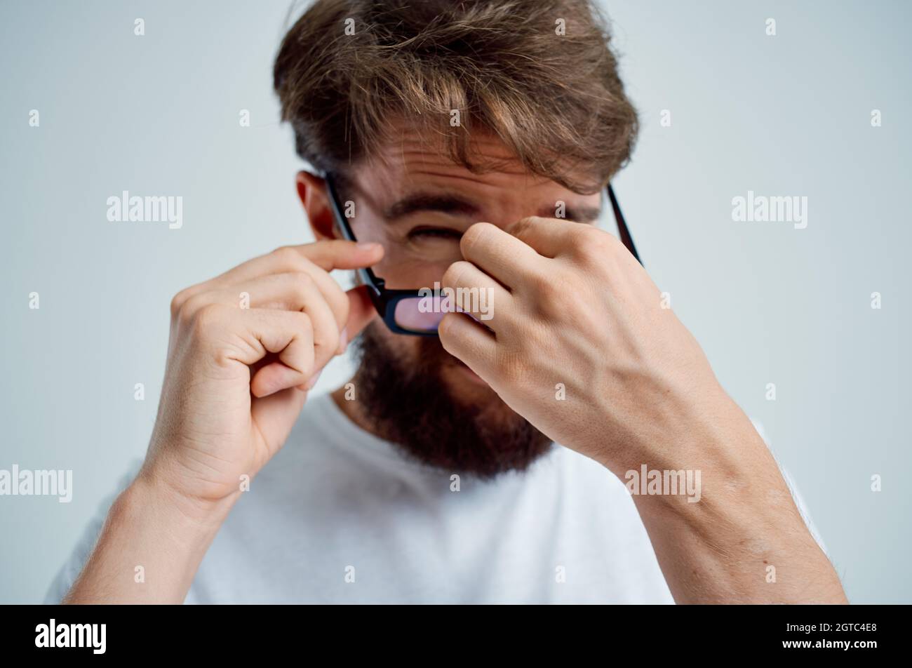 sick man with glasses in hand vision problems isolated background Stock ...