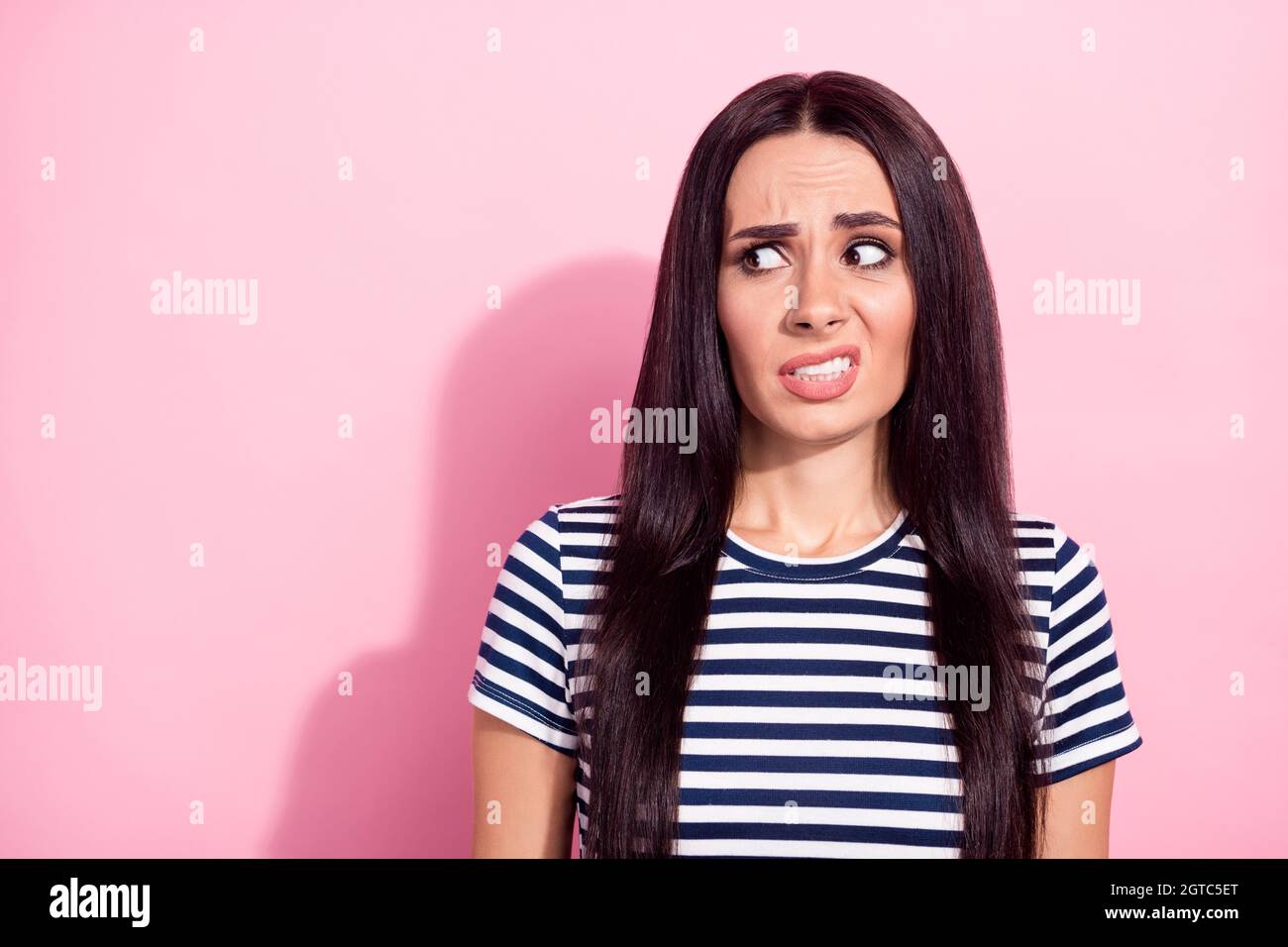 Photo of unhappy sad disgusted young woman look empty space make face ...