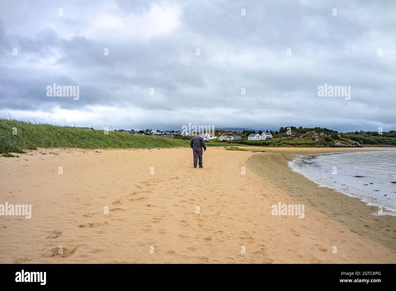 Man walking at Bunbeg beach , Co. Donegal, Ireland Stock Photo - Alamy