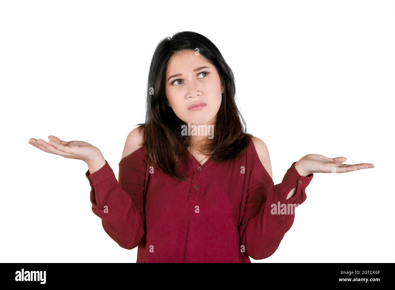 Confused Woman Standing Against White Background Stock Photo - Alamy