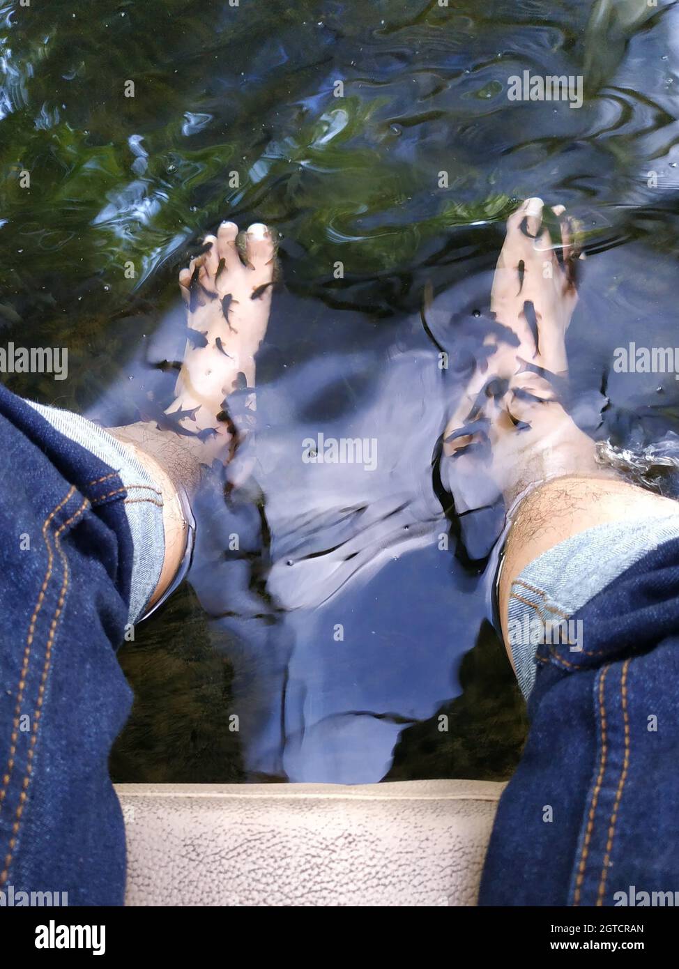 Man dipping foot water hi-res stock photography and images - Alamy