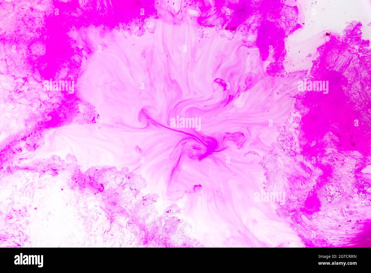 Swirly colour patterns on water Stock Photo - Alamy