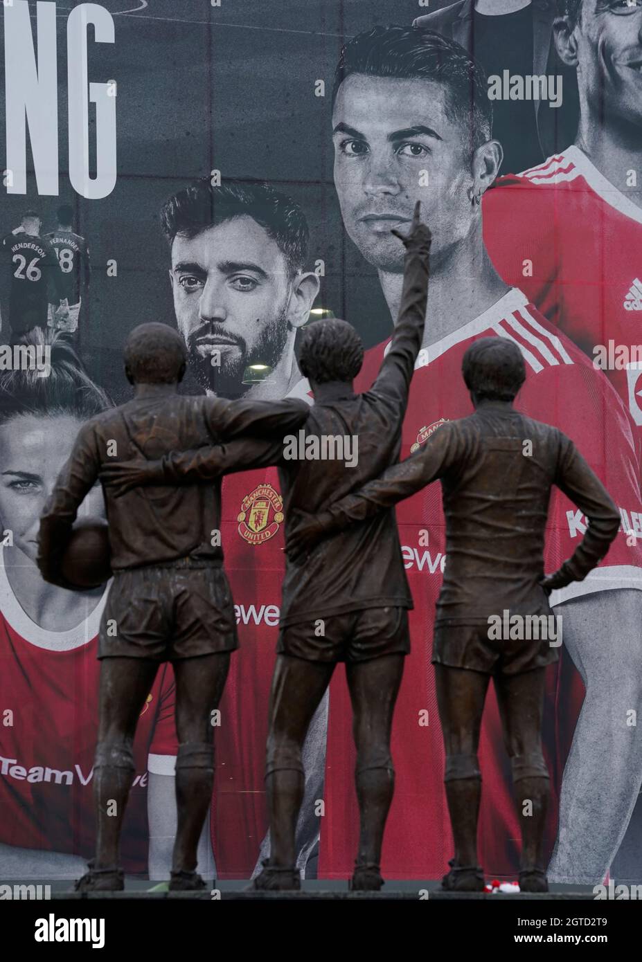 Manchester, UK. 2nd October 2021. The United Trinity statue faced by a ...