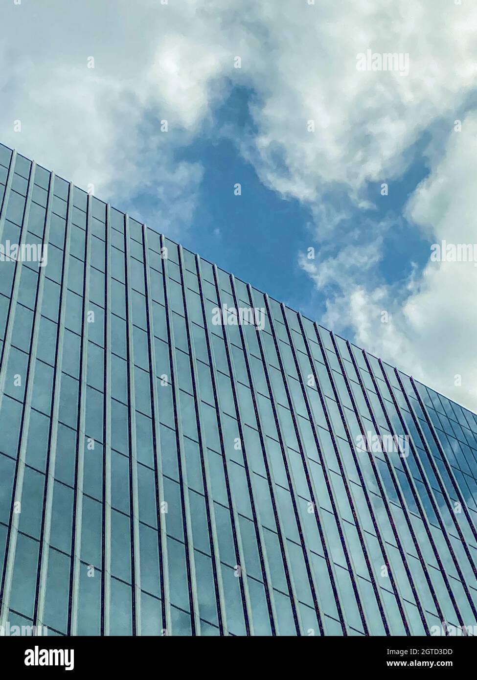 Tall office building in blue sky background Stock Photo - Alamy
