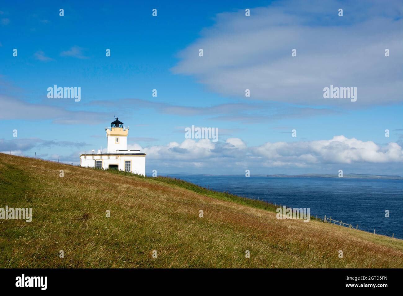 Windblown grasses leading to a lighthouse Stock Photo - Alamy