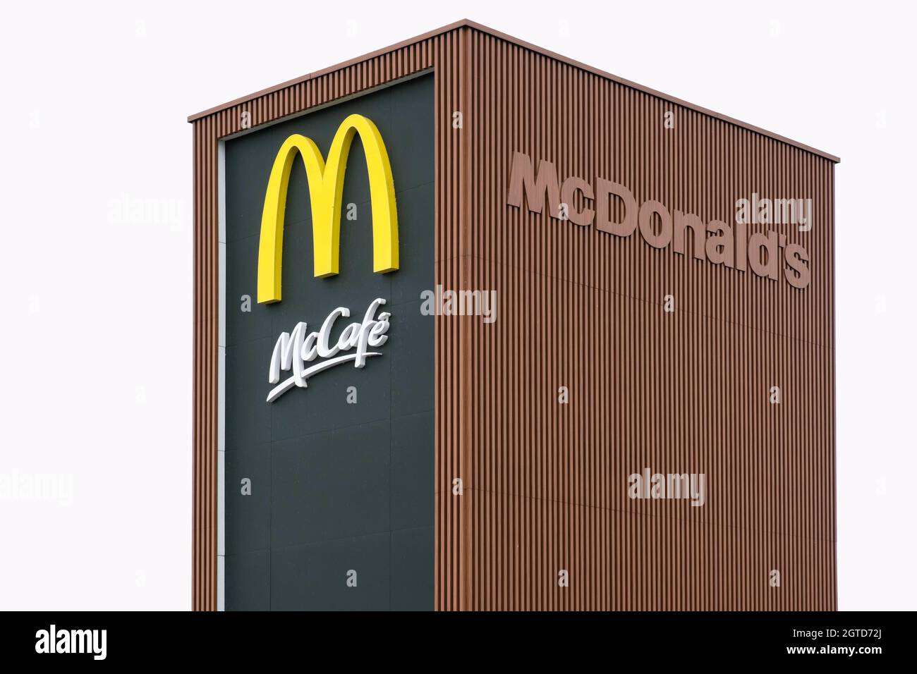 Tall modern building with logo of McDonald's restaurant and McCafe in ...