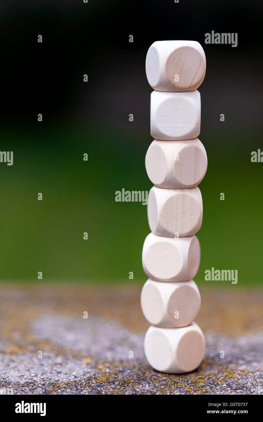 High tower of empty blank wooden dice, simple cubes, blocks stacked ...