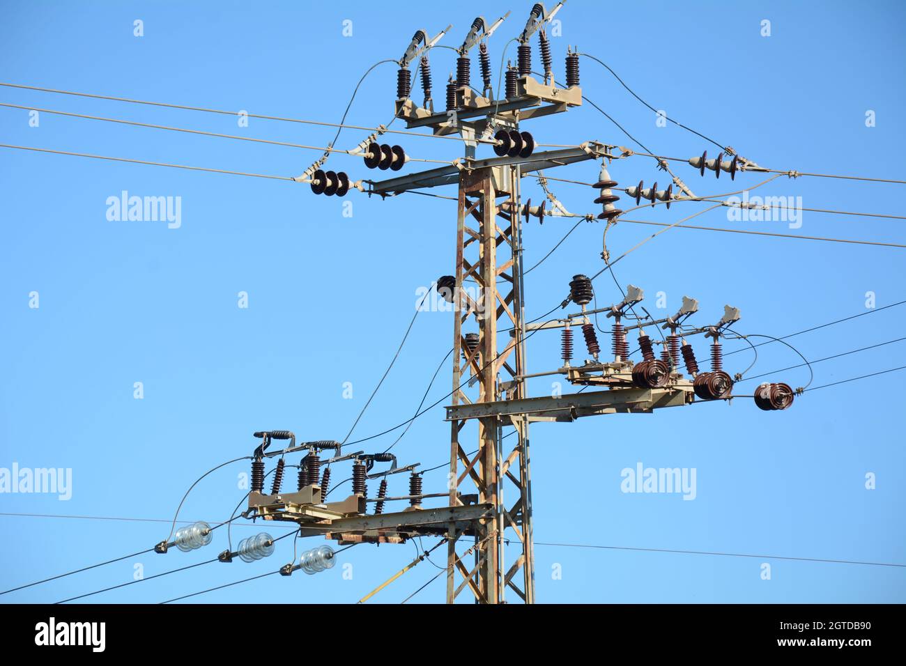 Low angle close-up view of the top part of an electricity distribution ...