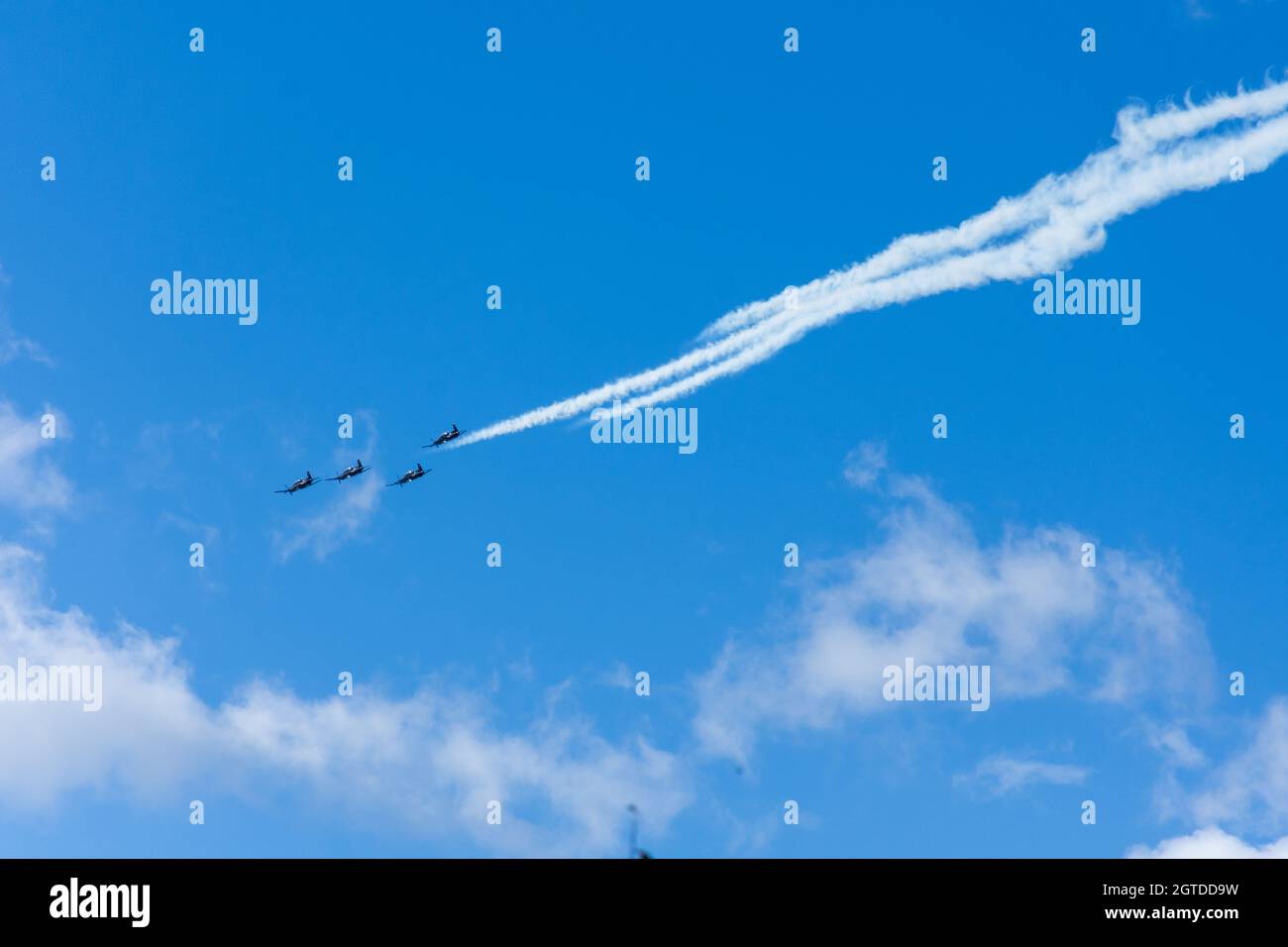 Airplanes flying in formation with smoke trails Stock Photo - Alamy