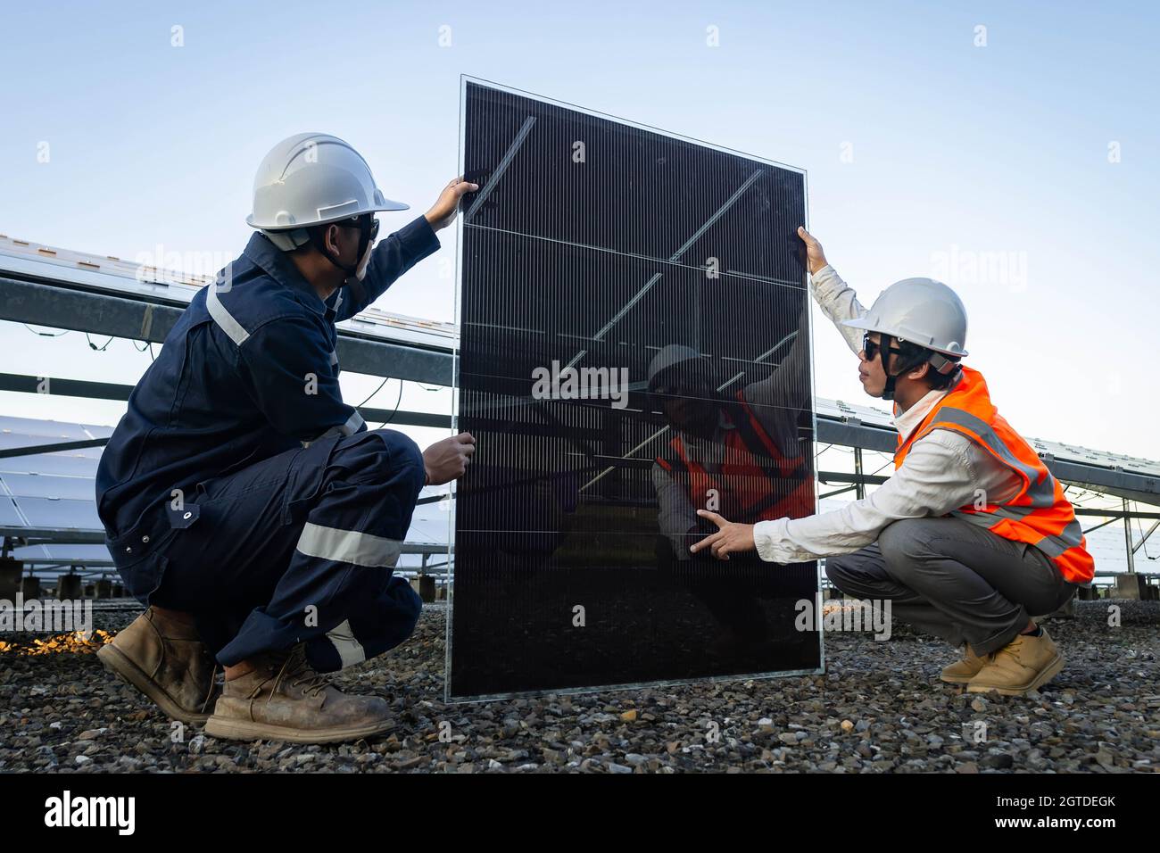 Technician is lifting the solar cell to replace the damaged one ...