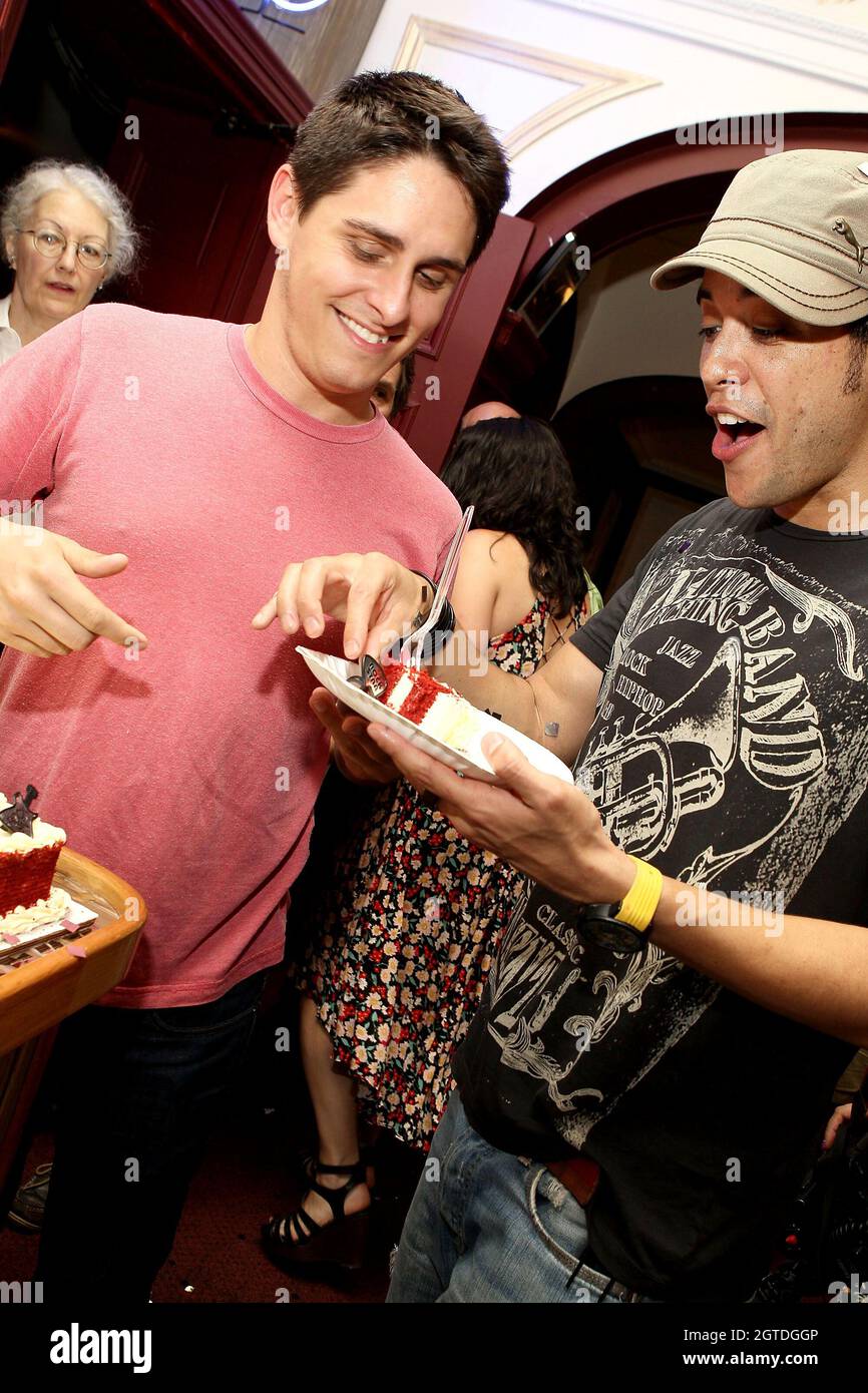 New York, NY, USA. 16 July, 2011. Justin Scribner, serves cake to, Dan ...