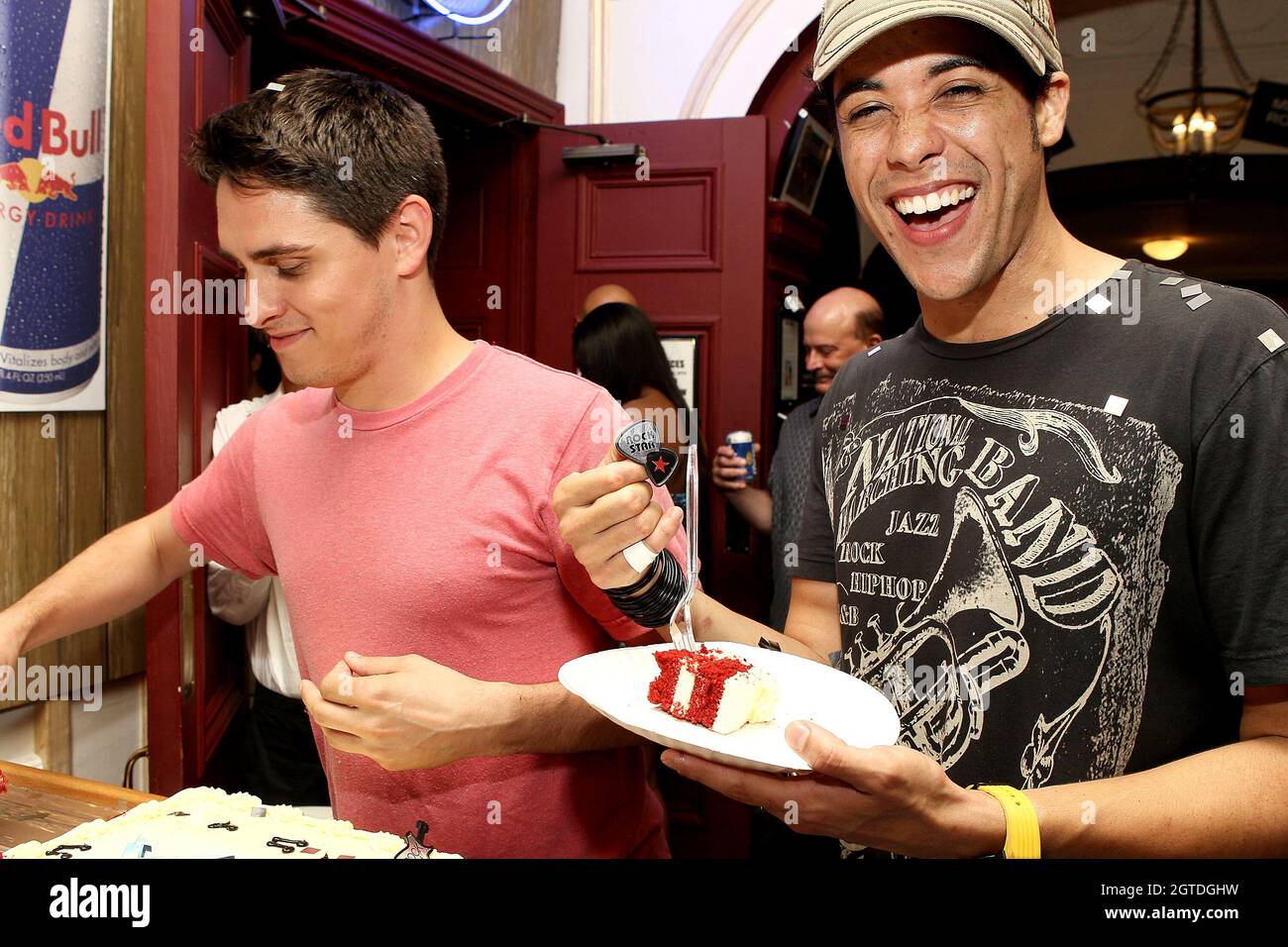 New York, NY, USA. 16 July, 2011. Justin Scribner, serves cake to, Dan ...