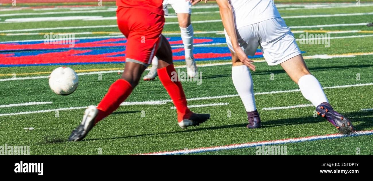 Chasing soccer ball hi-res stock photography and images - Alamy