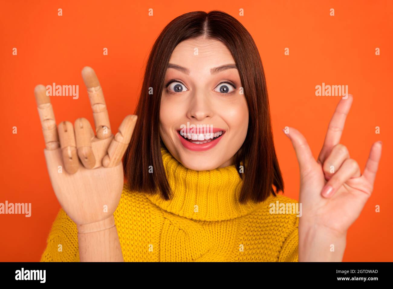 Photo of young woman show rock sign wooden hand prosthesis medicine ...