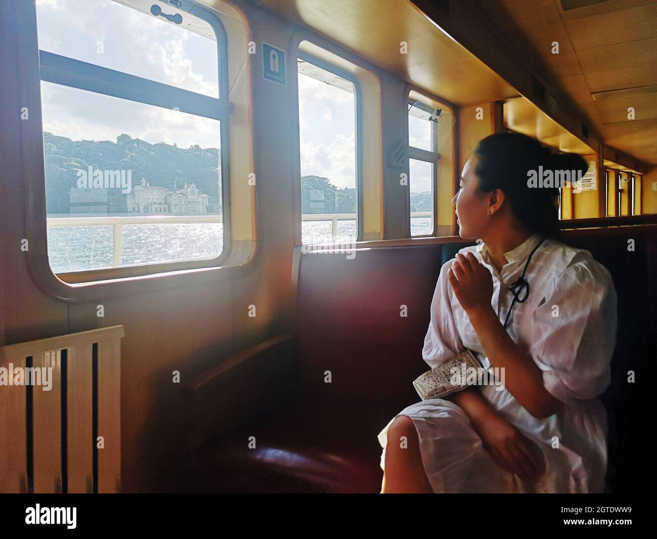 Girls looking through window train hi-res stock photography and images ...