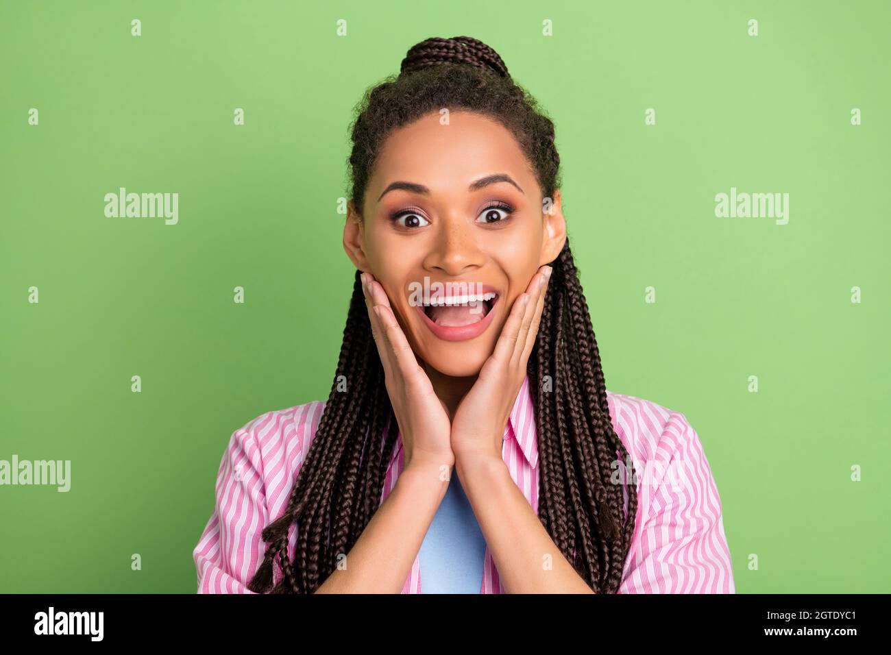 Photo of young amazed shocked dark skin woman hold hands cheeks face ...