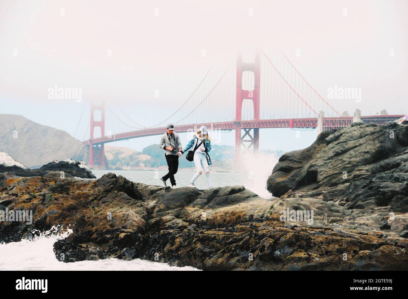 Rock against golden gate bridge san francisco hi-res stock photography ...