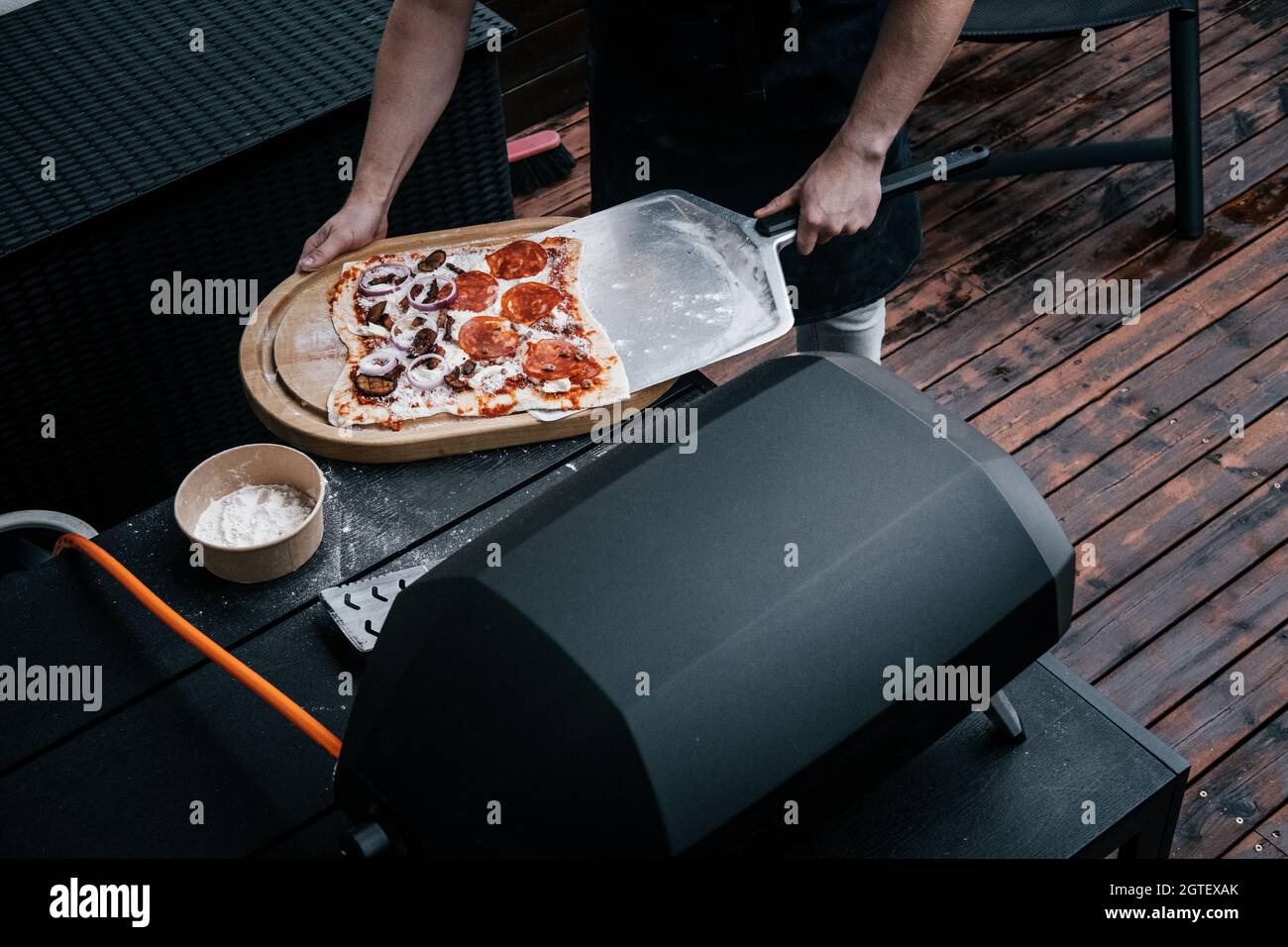 Cooking pizza in garden Stock Photo - Alamy