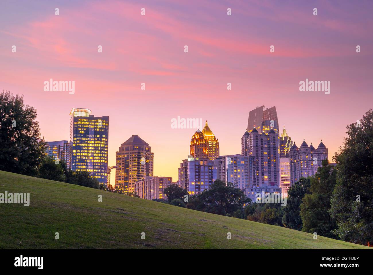 Midtown Atlanta skyline from the park at sunset Stock Photo - Alamy