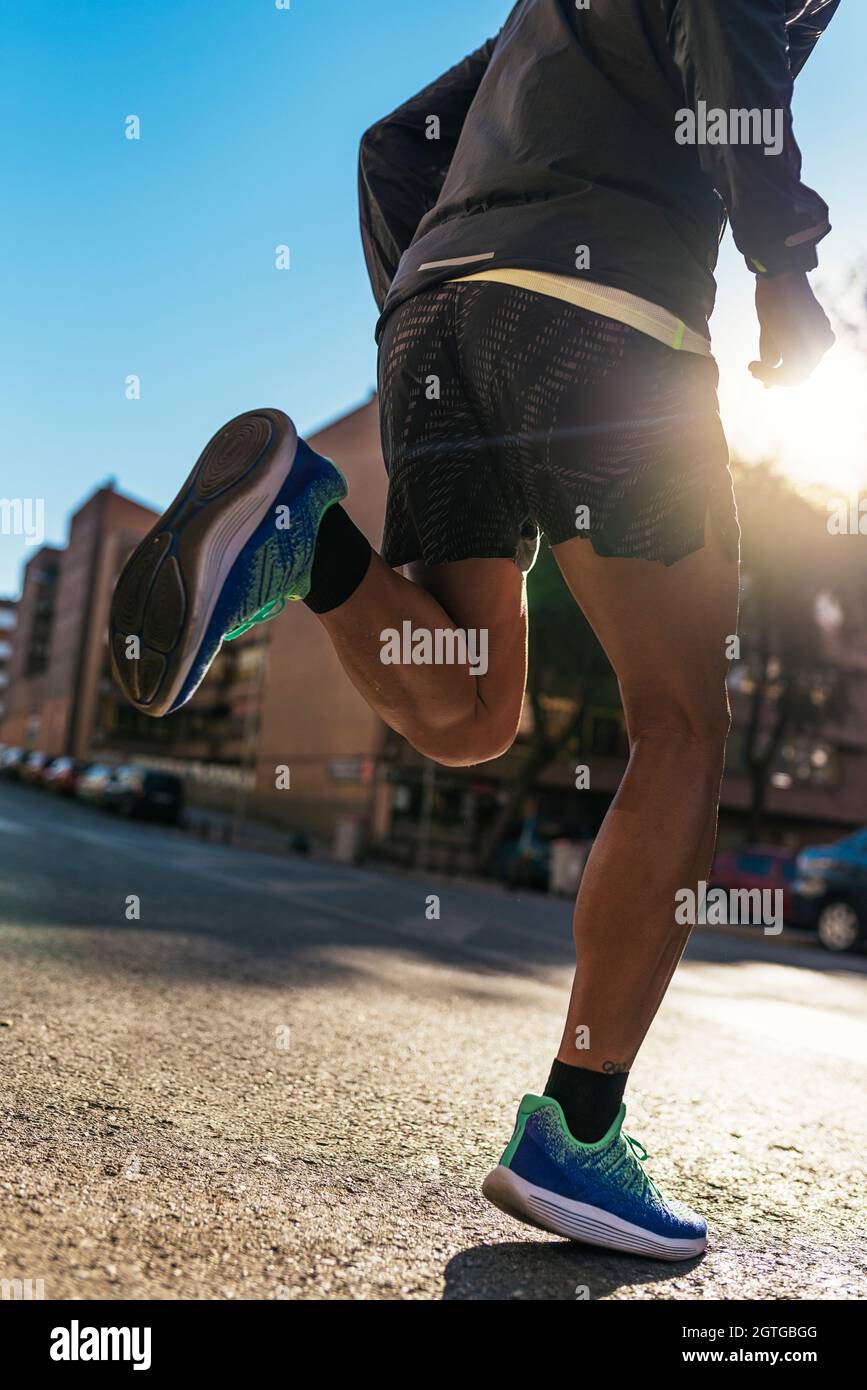 Shadow man running on street hi-res stock photography and images - Alamy