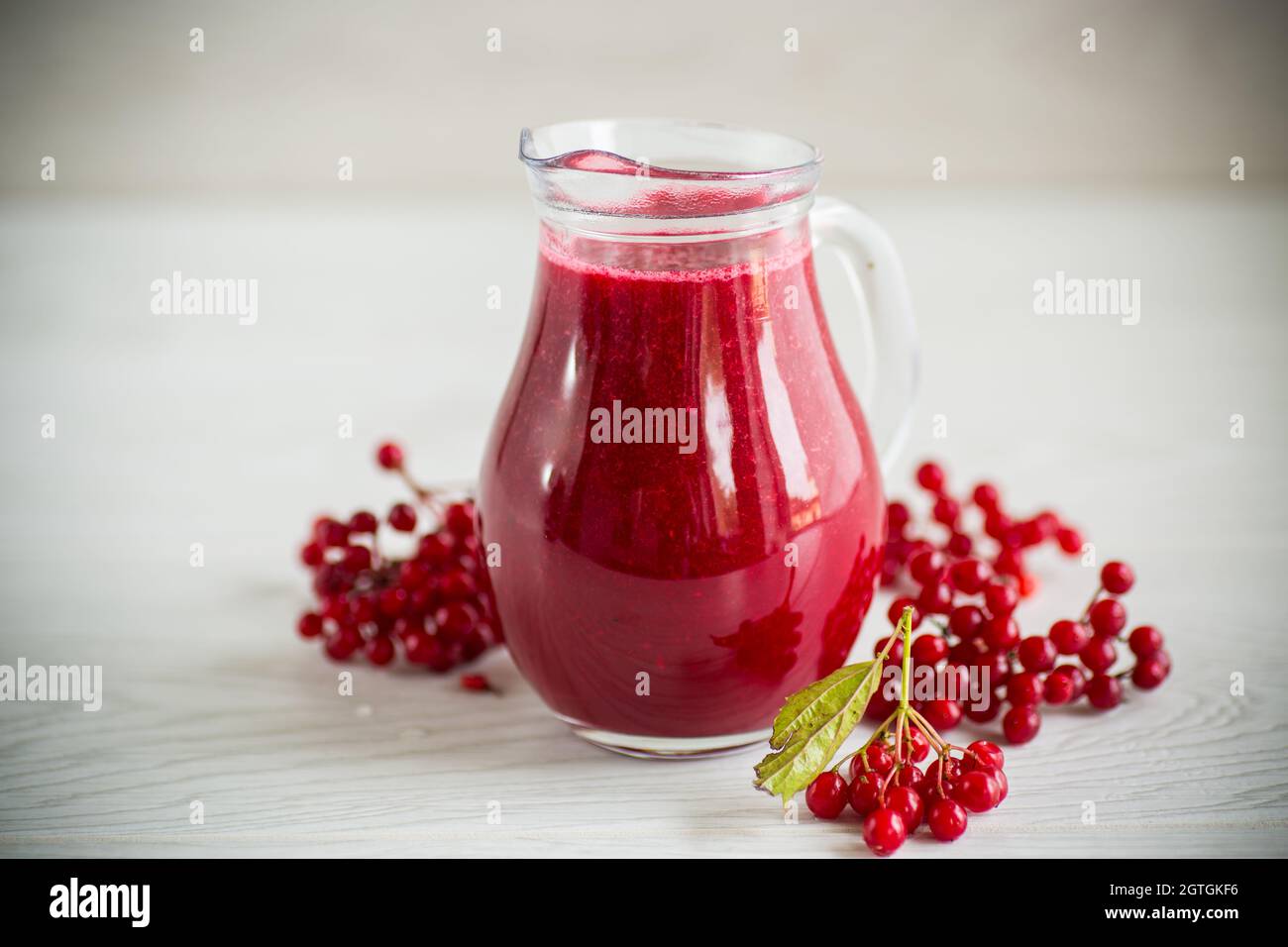 freshly squeezed thick natural juice with pulp from ripe red viburnum ...