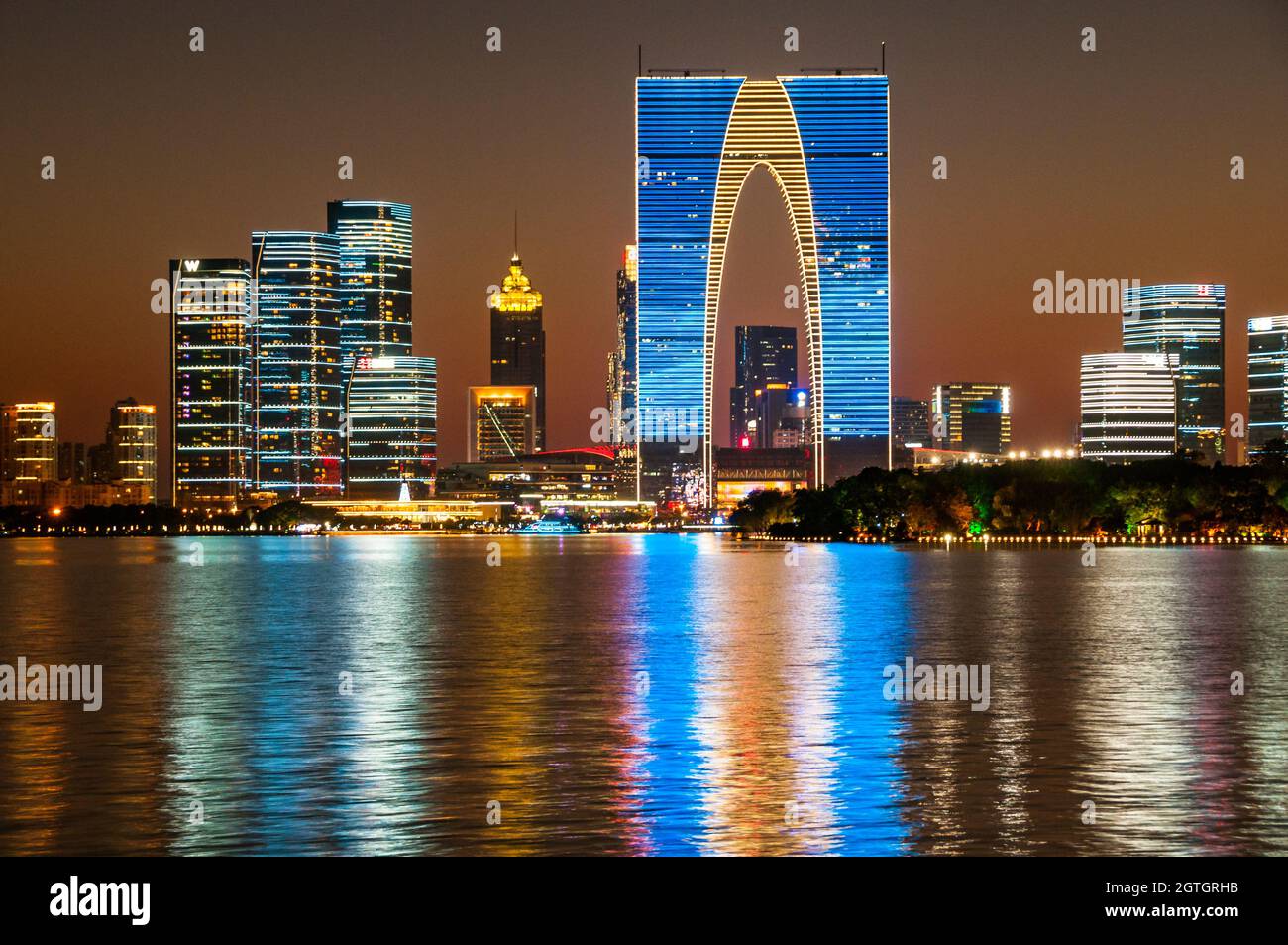 Suzhou’s Gate of the Orient building lit up at night in Jiangsu Province, China Stock Photo - Alamy