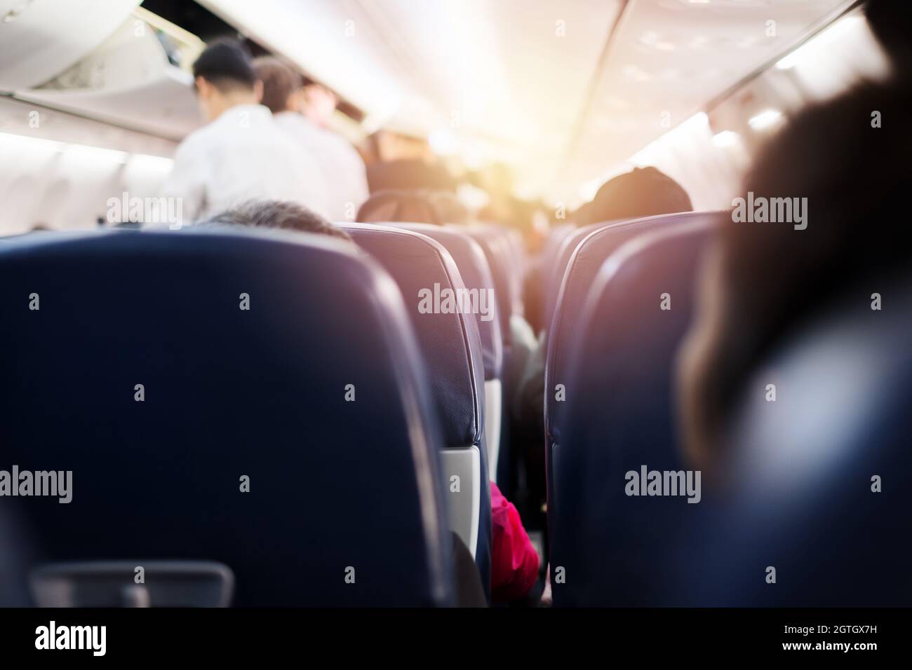 Crowded plane seats hi-res stock photography and images - Alamy