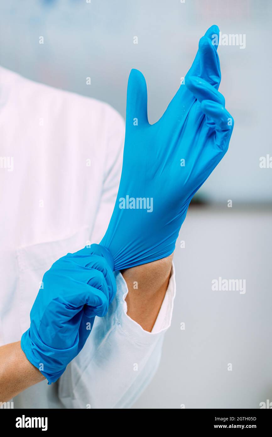 Lab technician gloves protective clothing hi-res stock photography and ...
