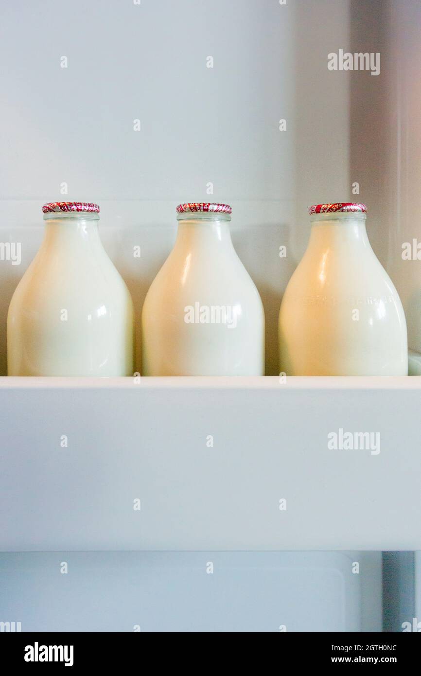 Glass milk bottles in a fridge door hi-res stock photography and images ...