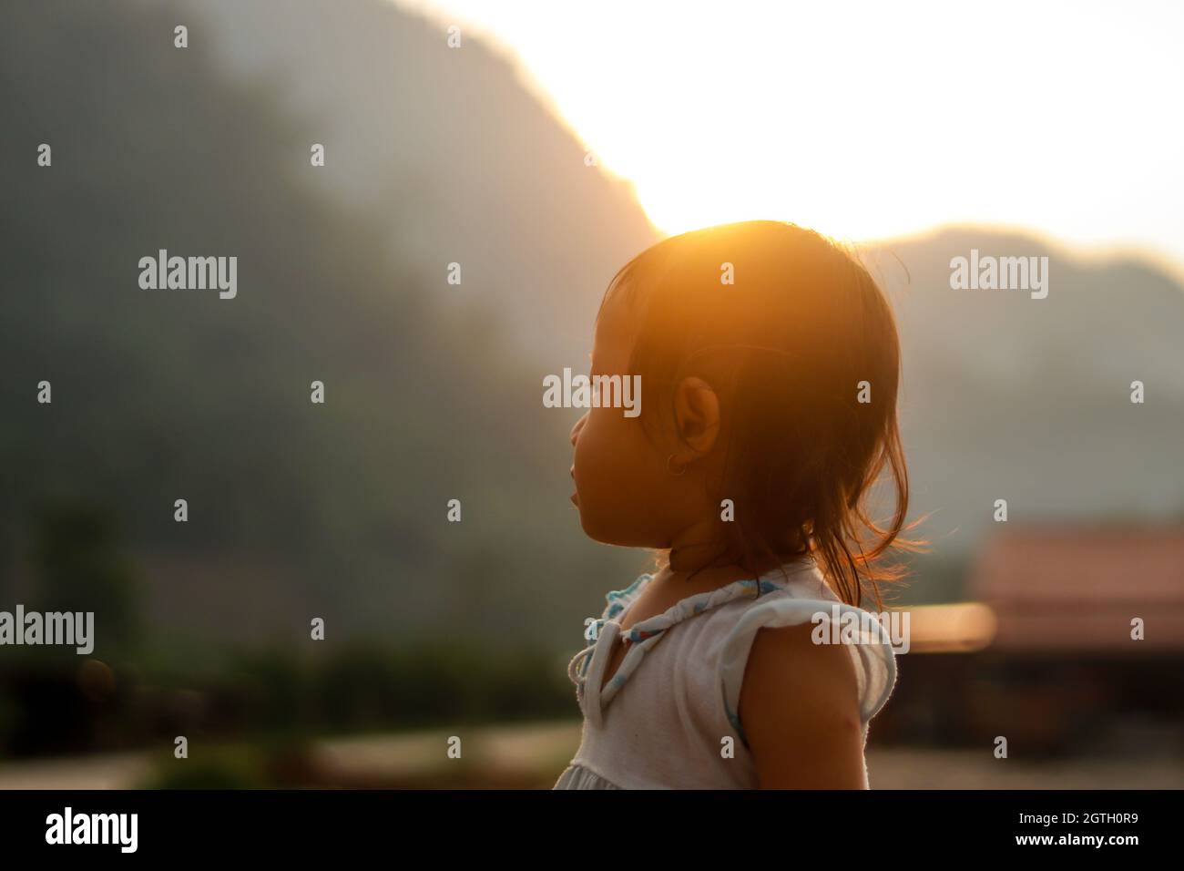 Woman standing back shining clothing hi-res stock photography and ...