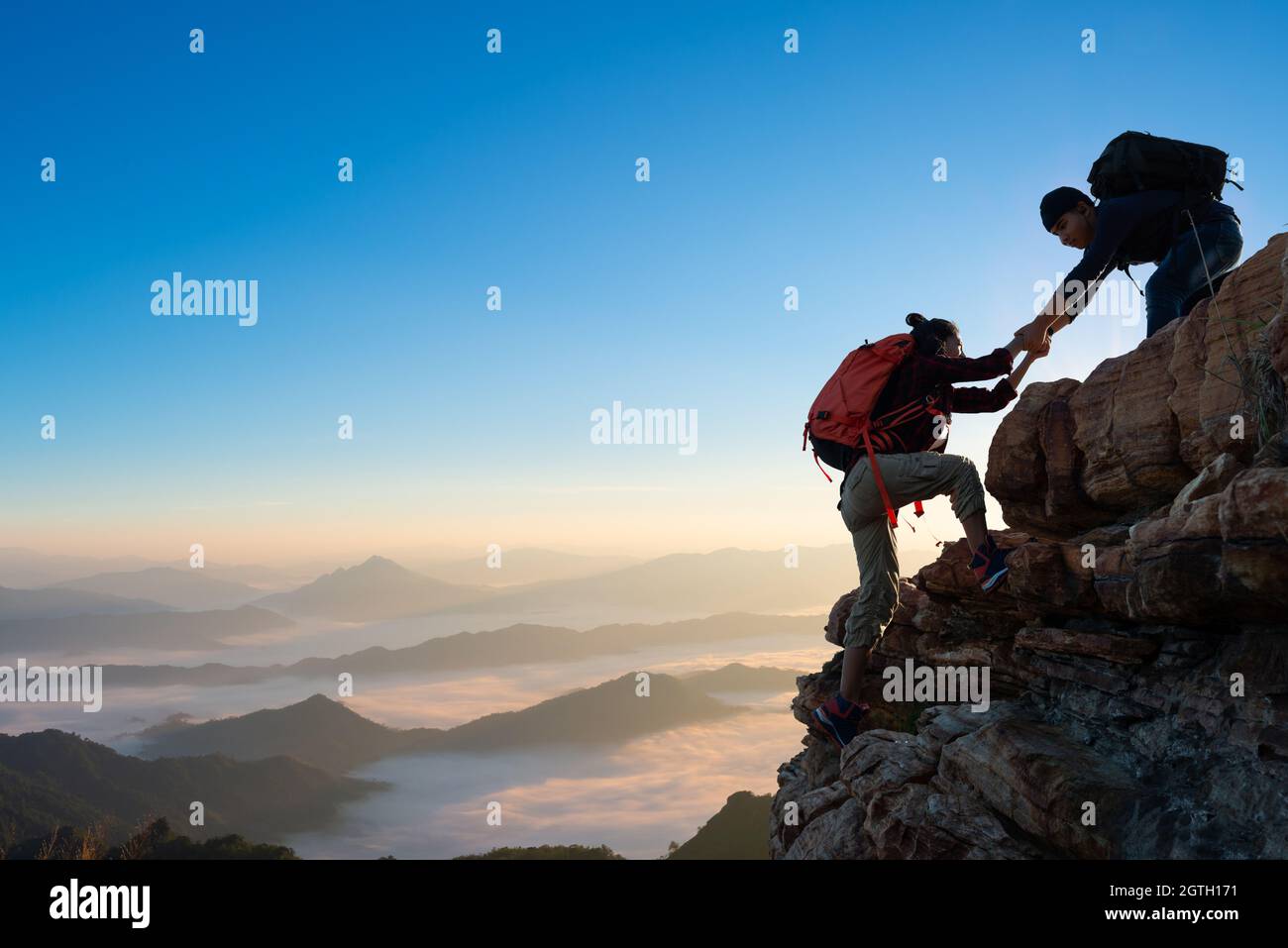 Teamwork couple hiking help other hi-res stock photography and images ...