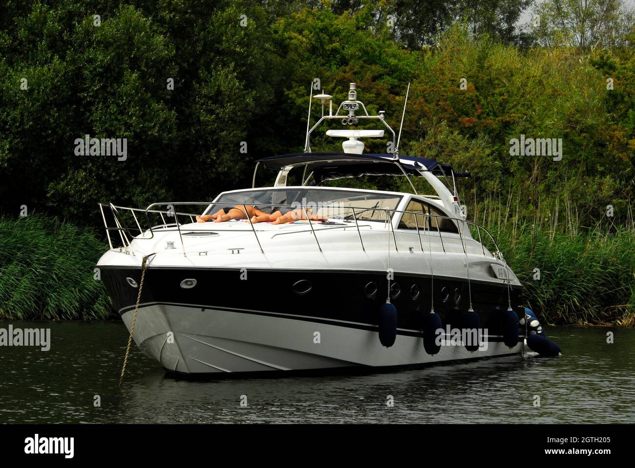 Sunbathing on a speedboat hi-res stock photography and images - Alamy