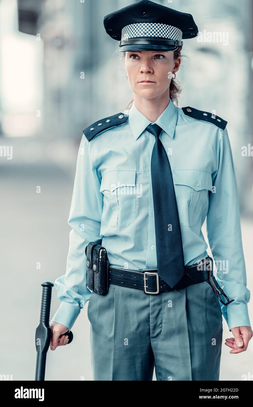 Police woman and holding police badge hi-res stock photography and ...