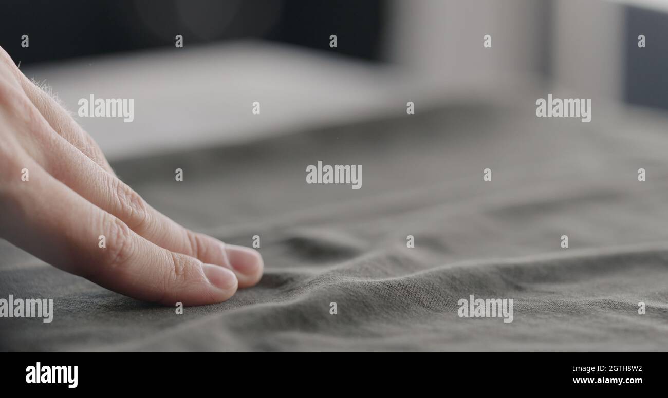 Finger touching cloth hi-res stock photography and images - Alamy