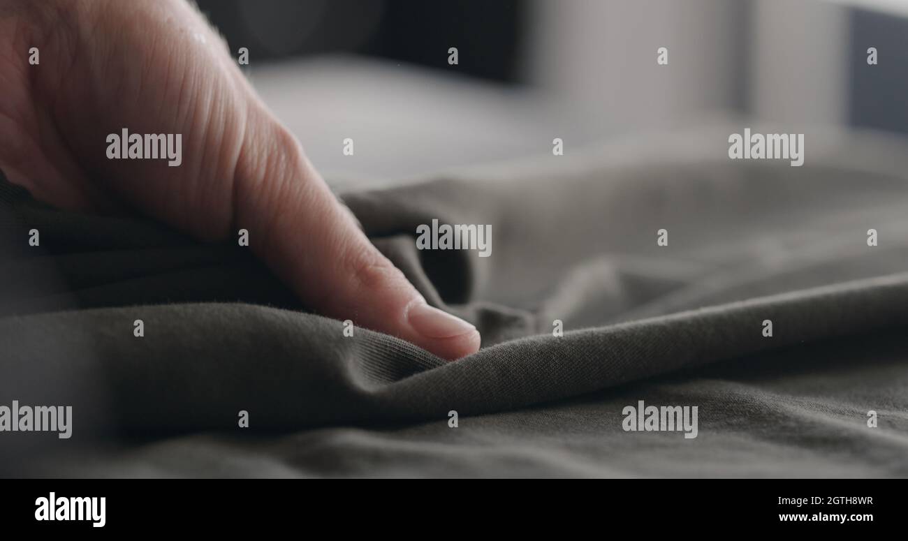 Finger touching cloth hi-res stock photography and images - Alamy