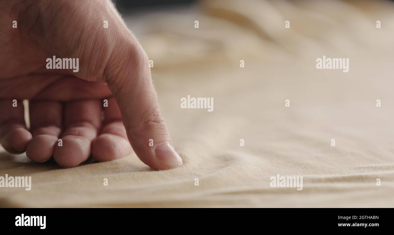 Finger touching cloth hi-res stock photography and images - Alamy