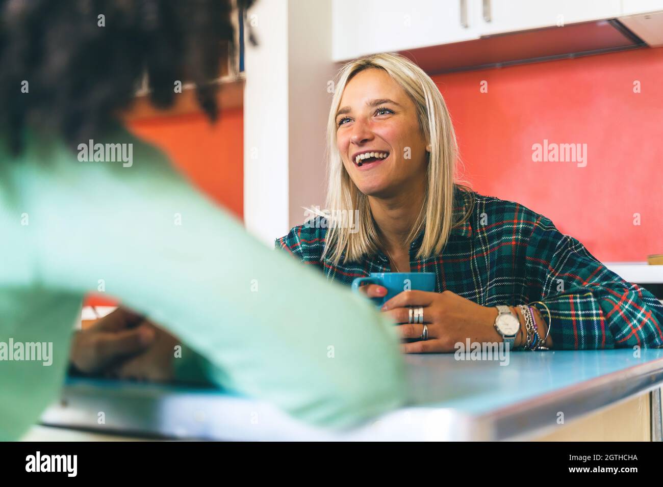 Interracial students best friends talking during the breakfast at the ...