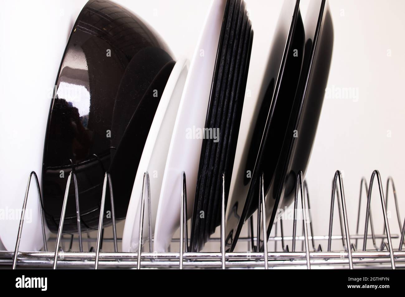 Different plates are in the cupboard close up Stock Photo - Alamy