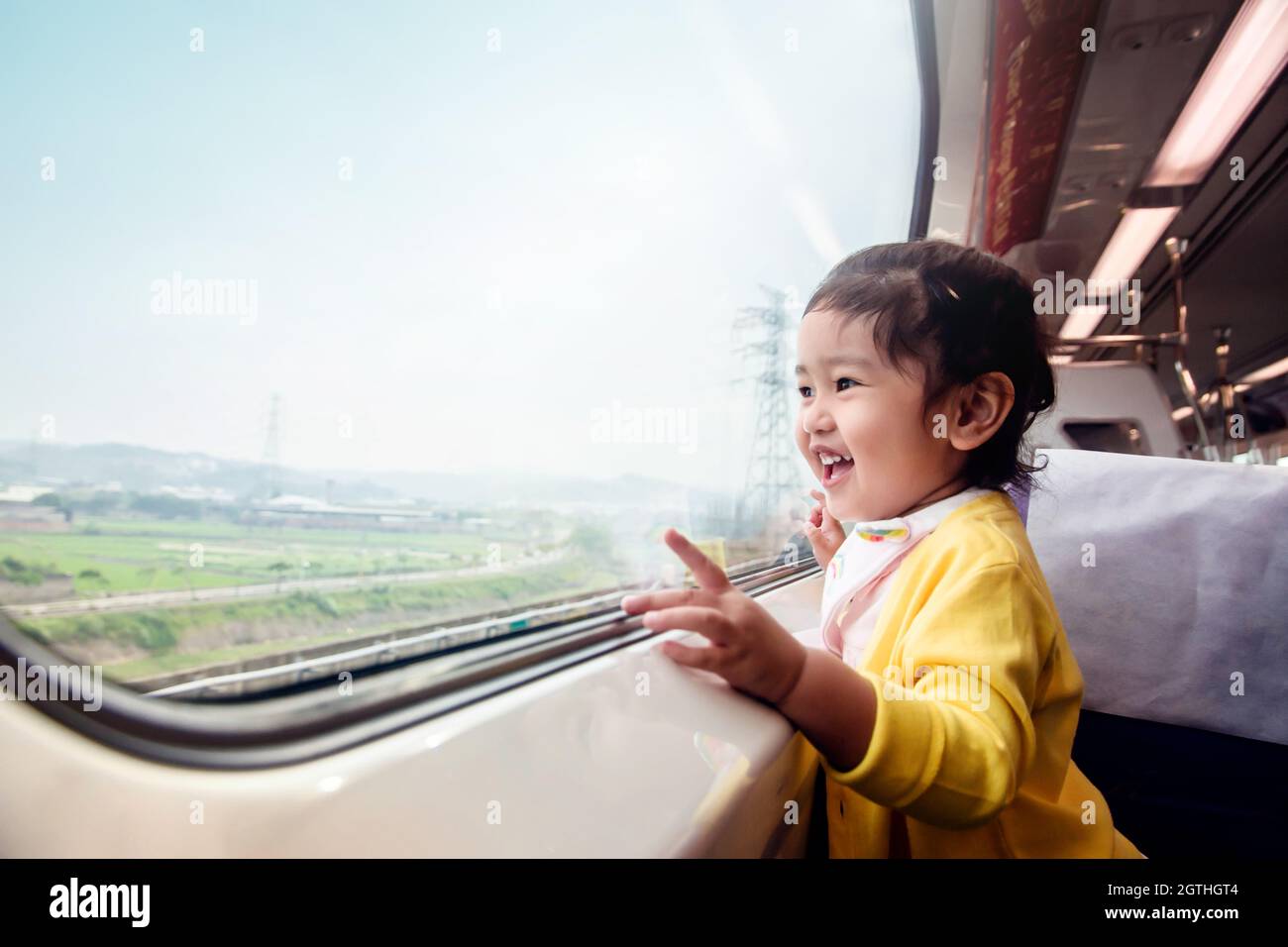Girls looking through window train hi-res stock photography and images ...