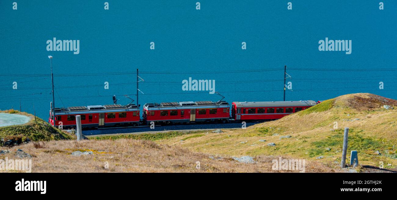 Bernina red train unesco heritage Stock Photo - Alamy