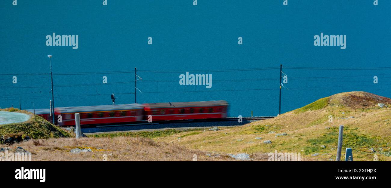 Bernina red train unesco heritage Stock Photo - Alamy
