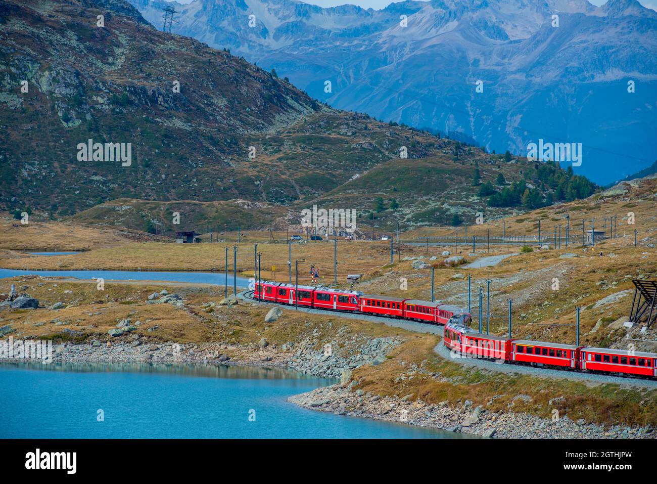 Bernina red train unesco heritage Stock Photo - Alamy
