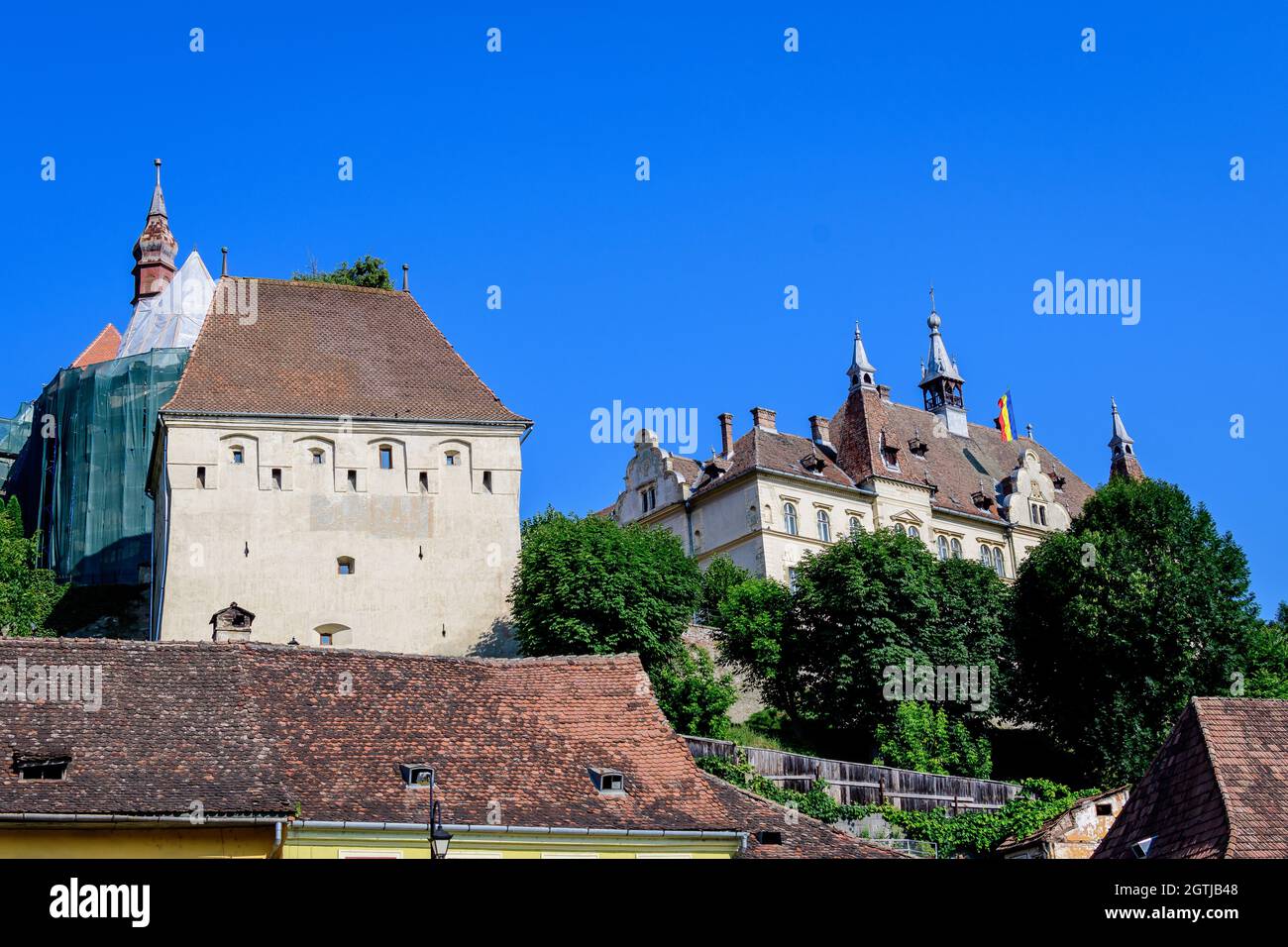 Large old white painted stone tower in the historical center of the ...