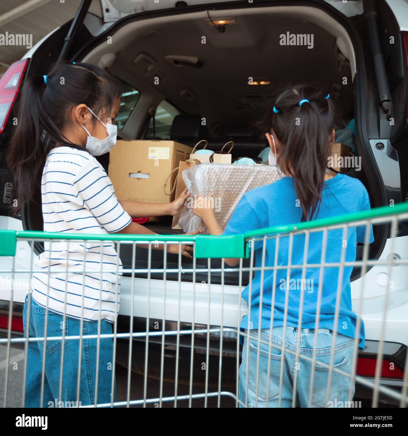 Loading shopping bags into car hi-res stock photography and images - Alamy
