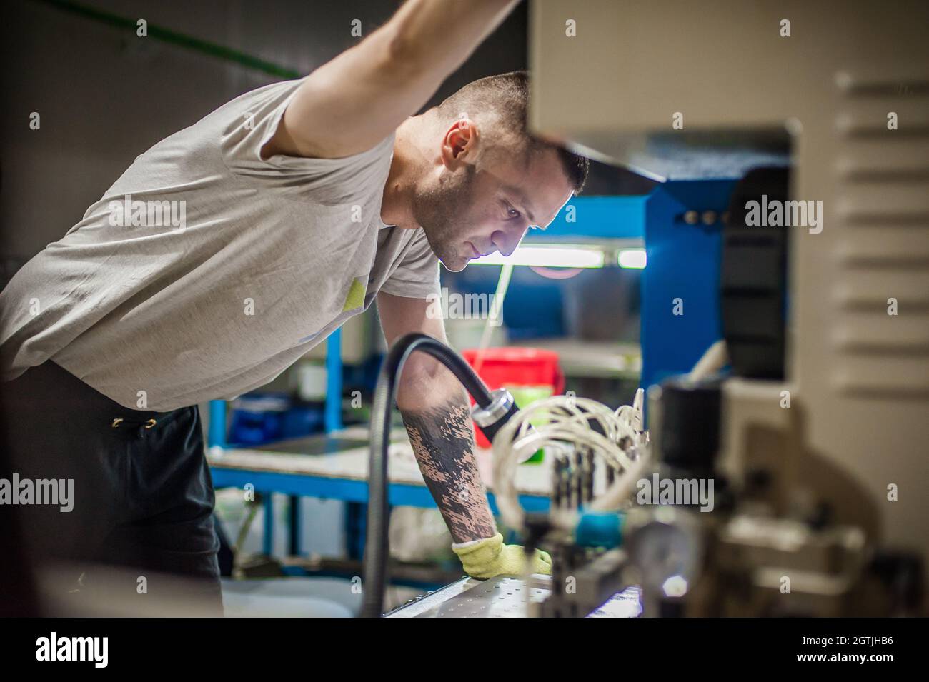 Professional worker technician machinist work in factory production ...